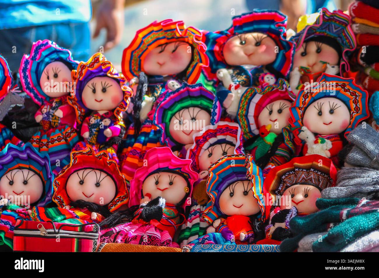 Peruvian traditional craft handmade dolls and textile. Colorful clothes ...