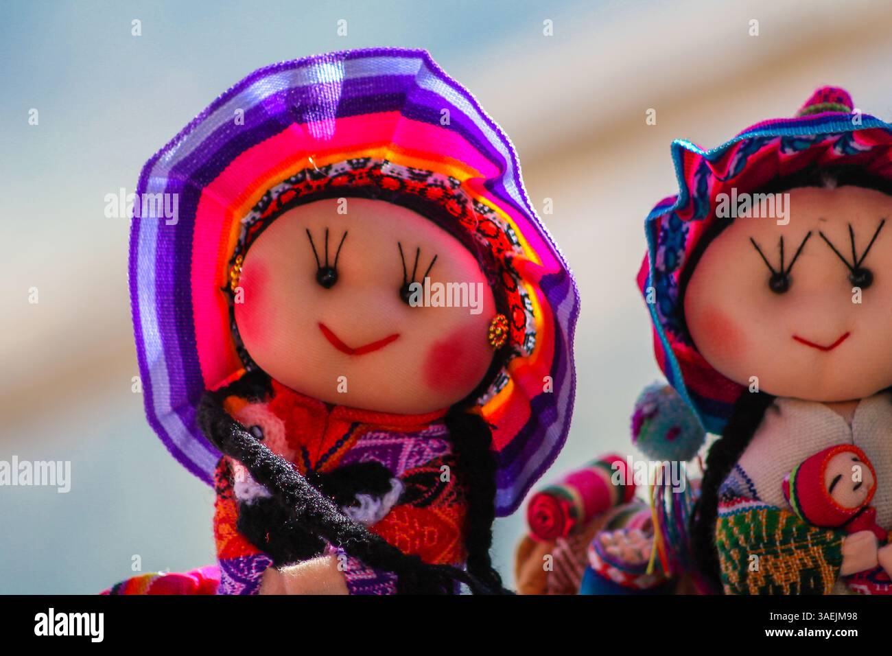 Peruvian traditional craft handmade dolls and textile. Colorful clothes ...
