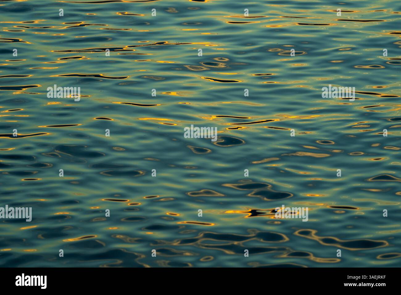 Calm ocean water reflecting sunset hi-res stock photography and images ...