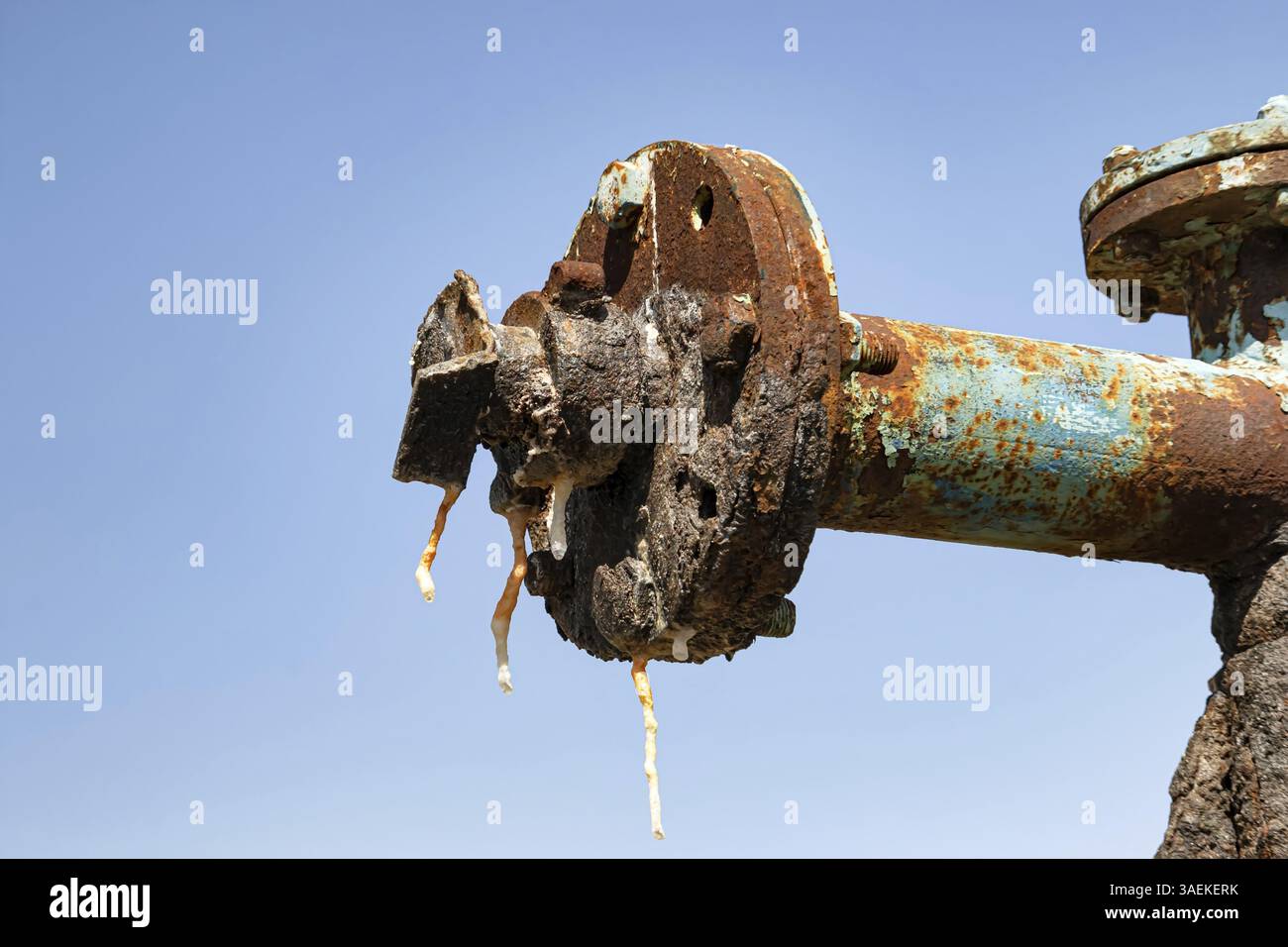 Old, rusty flanged connection with salt crystals penetrated through the ...