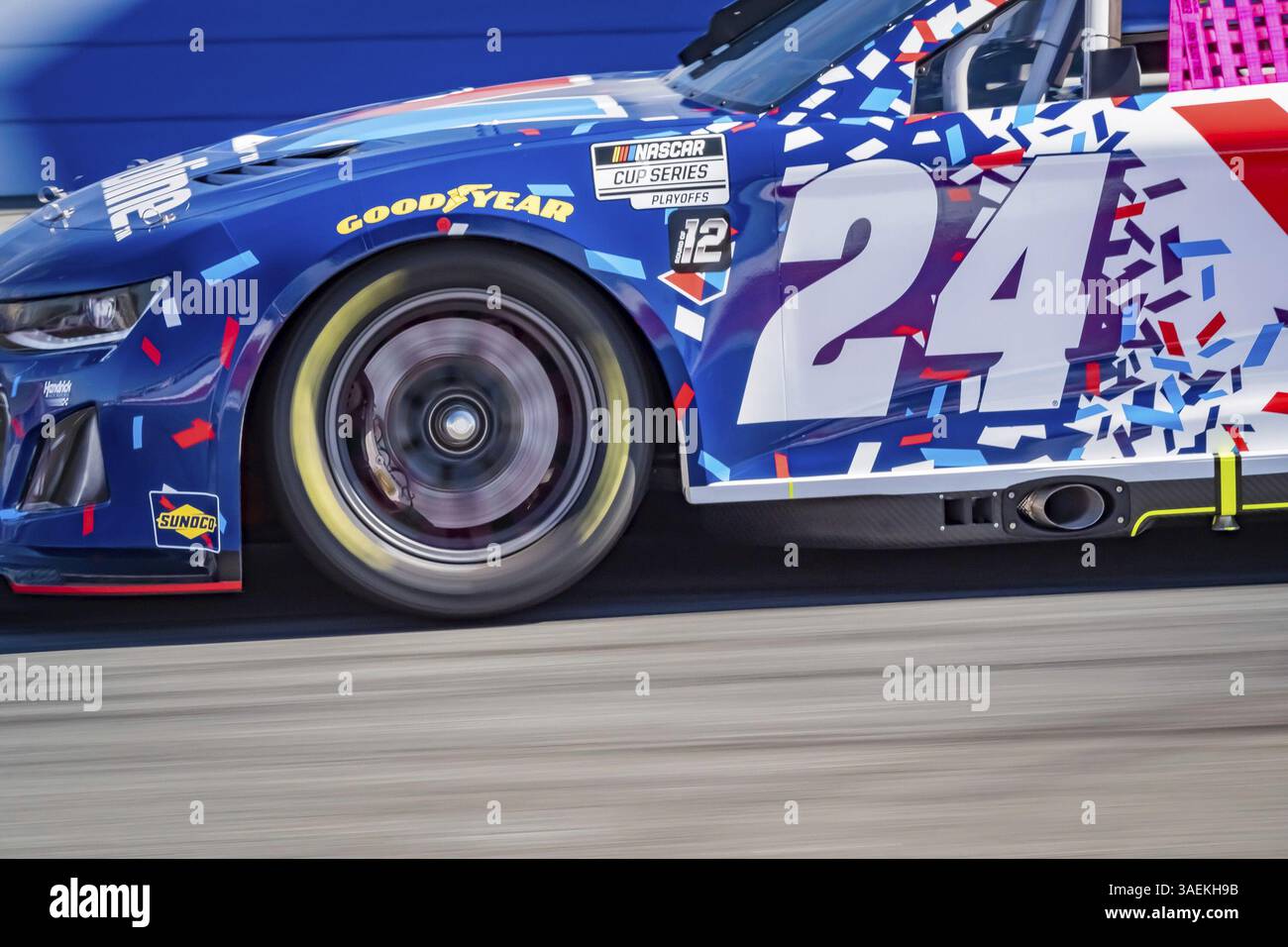NASCAR Cup Series driver, WILLIAM BYRON (24), races through the turns ...