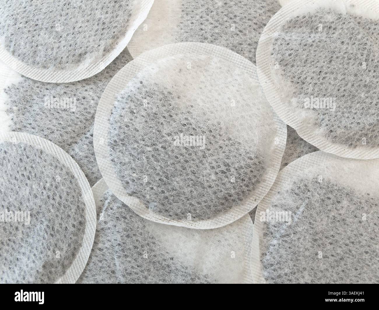 Photo of the many round tea bags background Stock Photo - Alamy