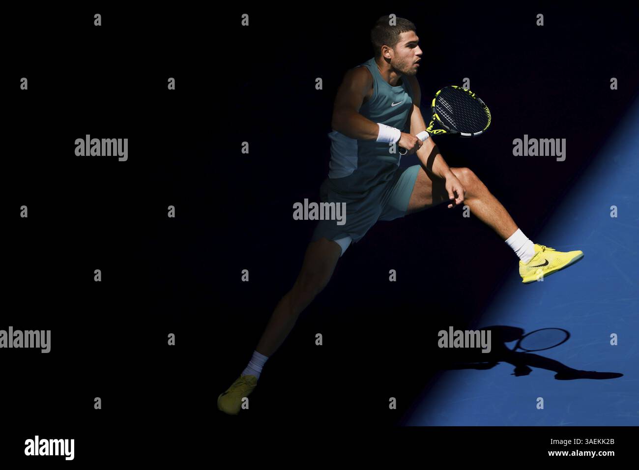 Spanish tennis player Carlos Alcaraz (ESP) playing forehand shot at Australian Open 2025 ...