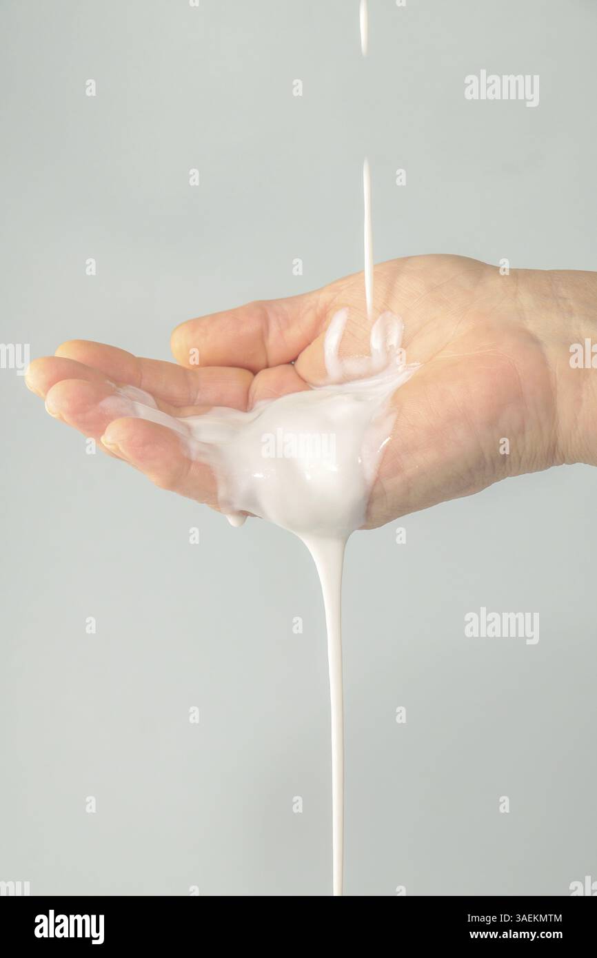 Womans hand pours out hi-res stock photography and images - Alamy