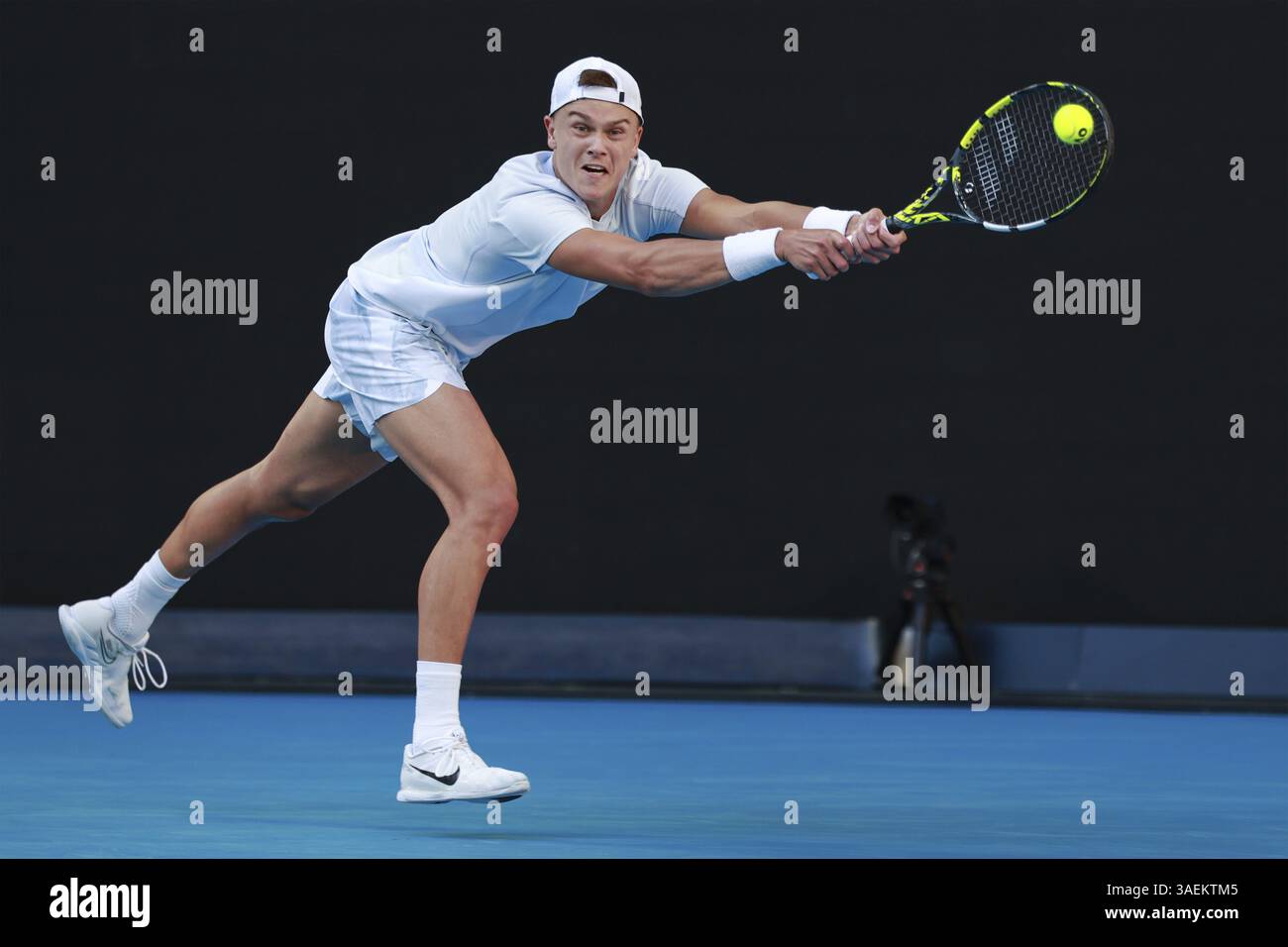 Danish tennis player Holger Rune playing a backhand shot at the ...