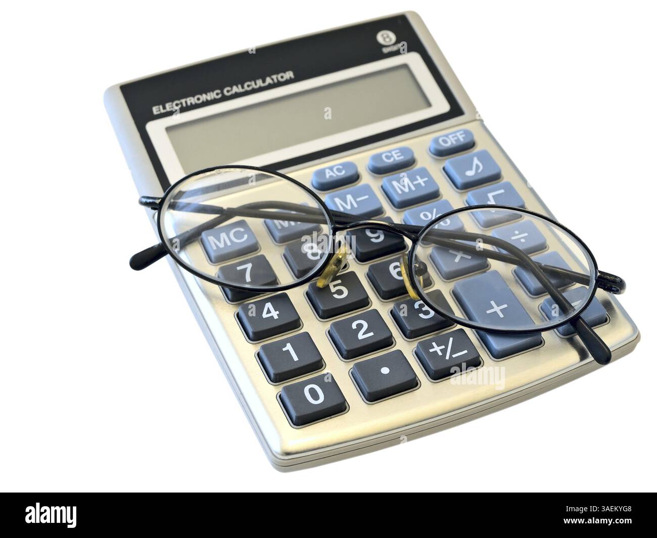 Digital calculator and glasses over the white background Stock Photo ...
