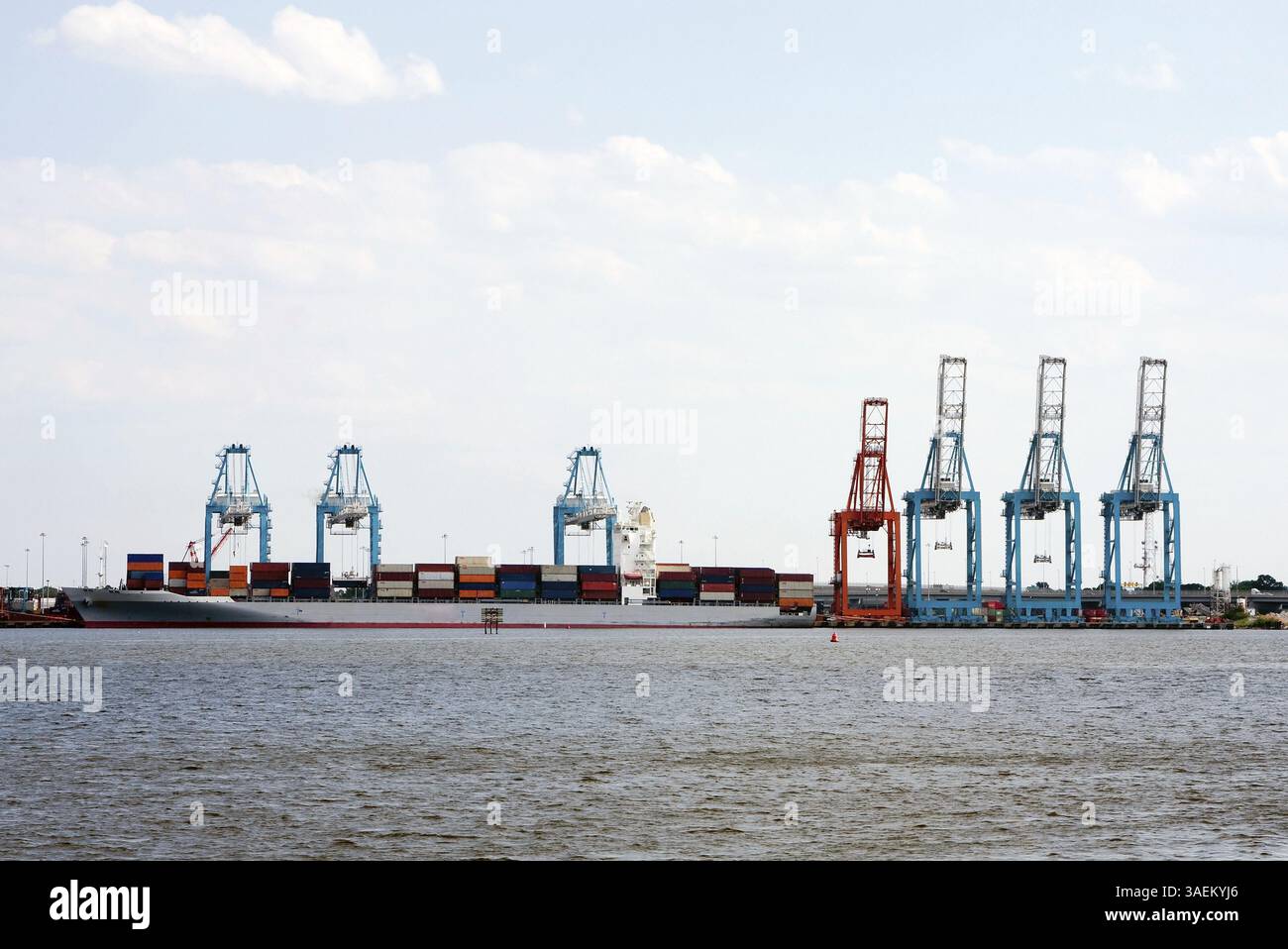 Commercial loading docks where cranes are loading containers filled ...