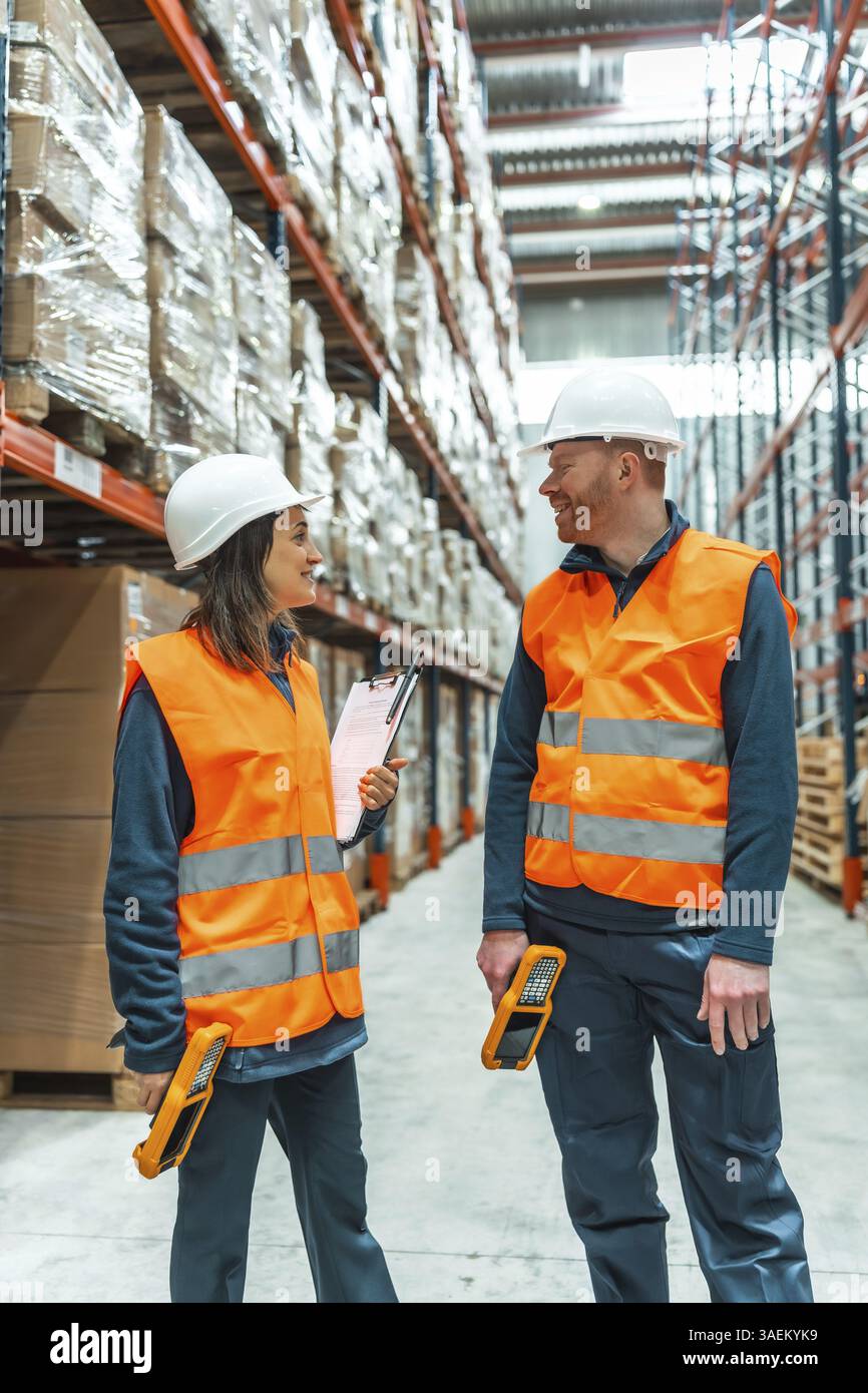 Warehouse workers wearing safety vests hi-res stock photography and ...