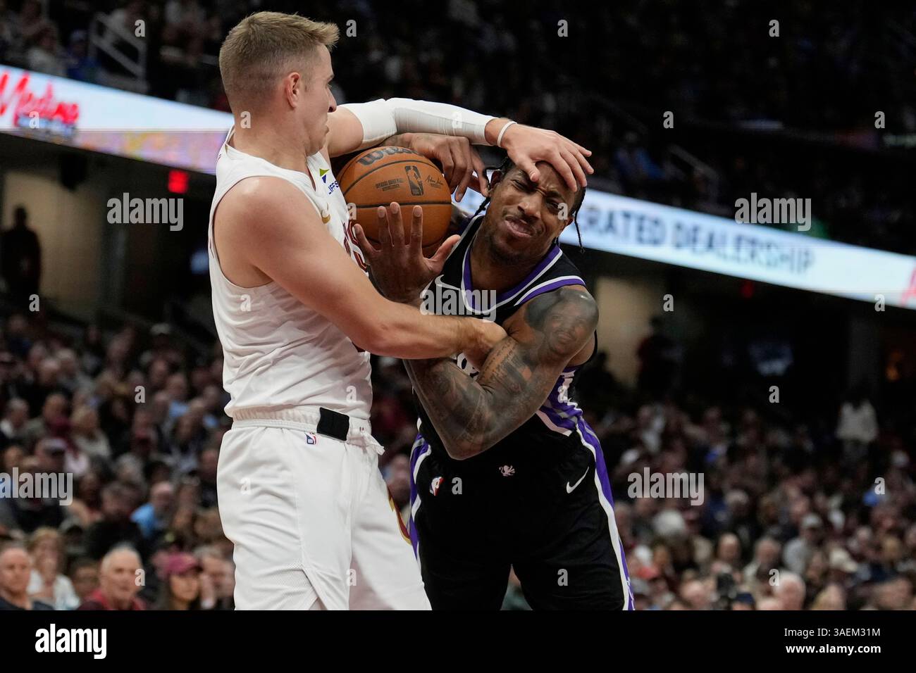 Sacramento Kings forward DeMar DeRozan, right, is fouled by Cleveland ...