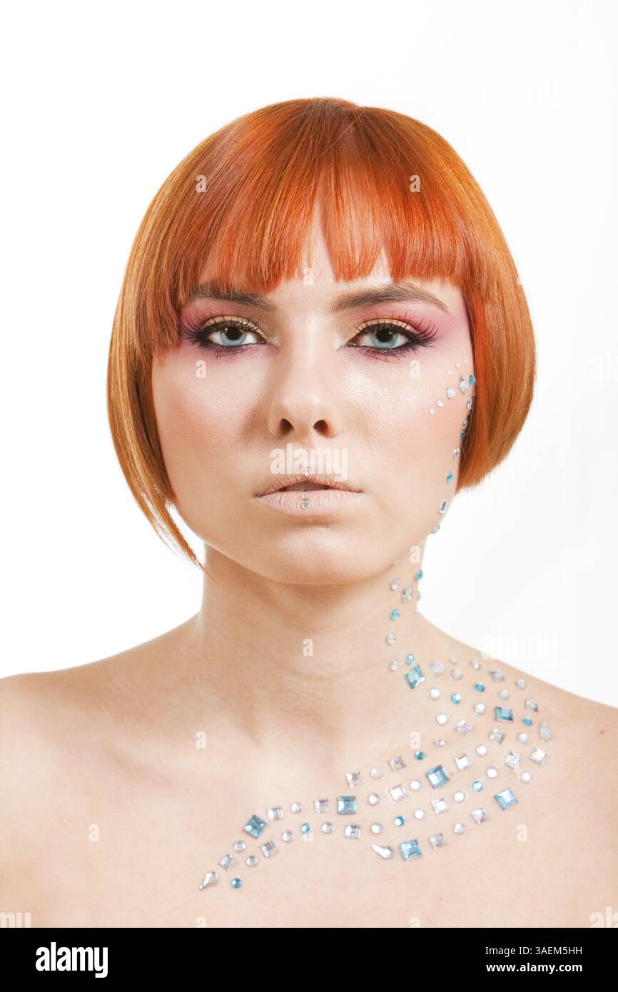 Beautiful face of a redhead Caucasian girl with sea blue eyes and ...