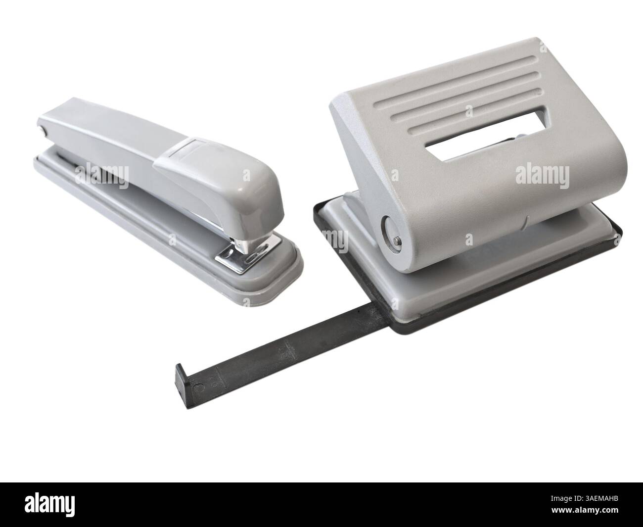 Hole puncher and stapler over the white background Stock Photo - Alamy