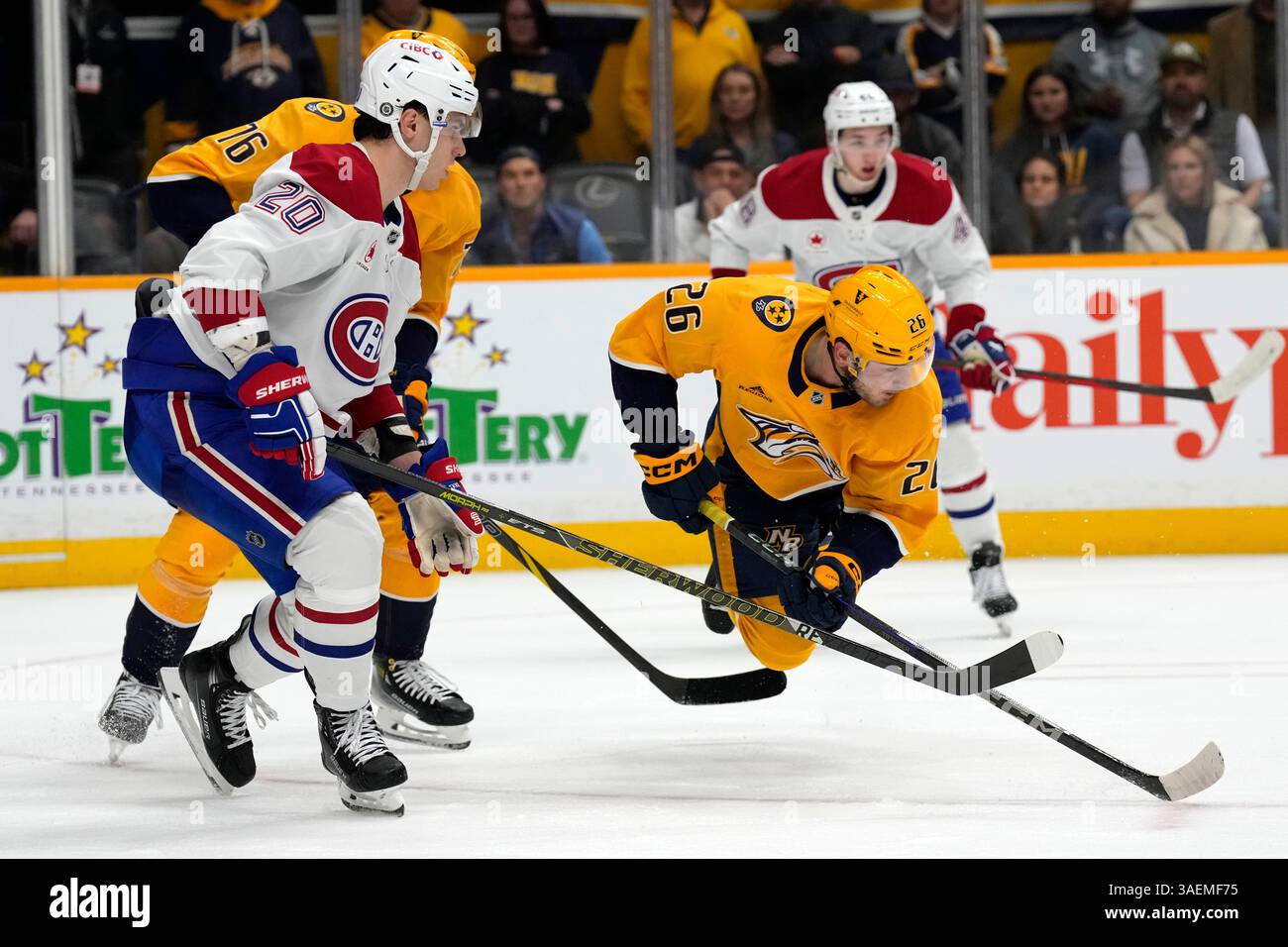 Nashville Predators left wing Kieffer Bellows (26) falls over the stick ...