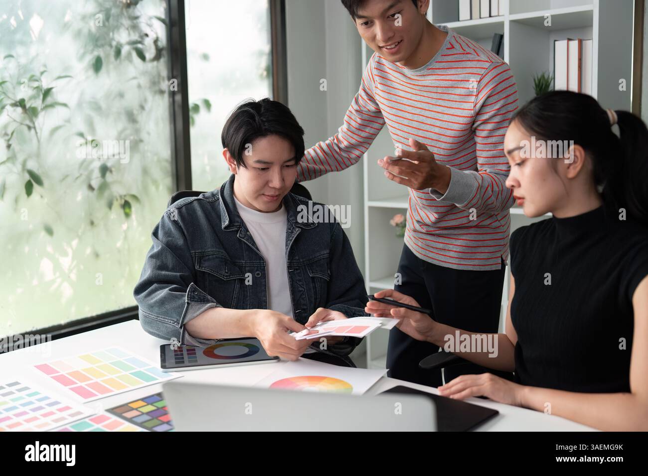 Design Review and Team Synergy. A team evaluating design concepts and ...