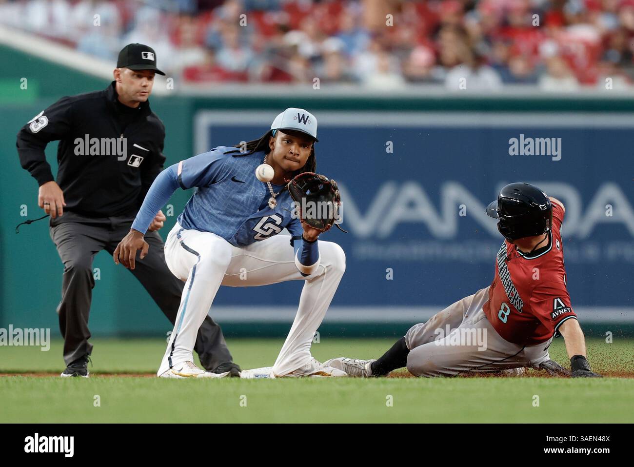 Arizona Diamondbacks' Garrett Hampson (8) avoids the tag from ...