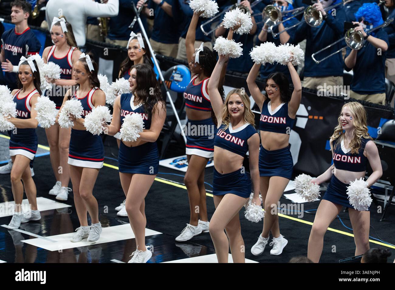 UConn Huskies cheerleaders entertain the fans during the Elite 8 NCAA ...