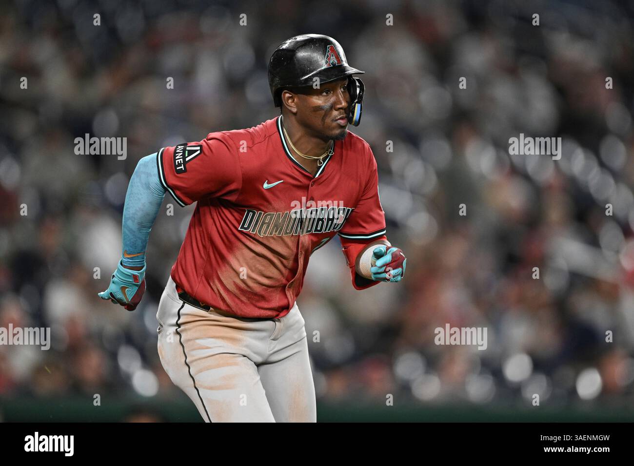 Arizona Diamondbacks' Geraldo Perdomo runs after hitting a single ...