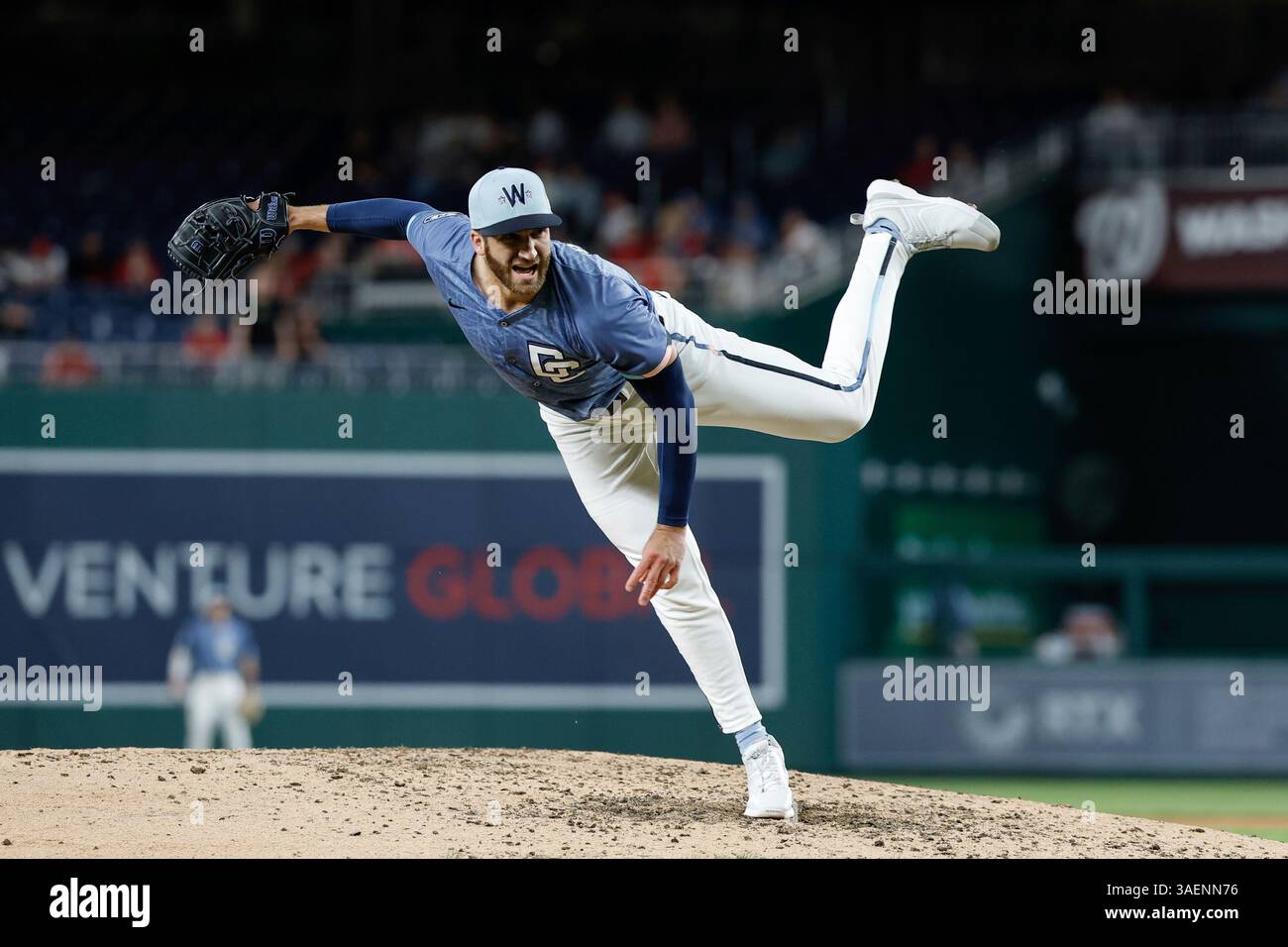 Washington Nationals pitcher Colin Poche follows through on his throw ...