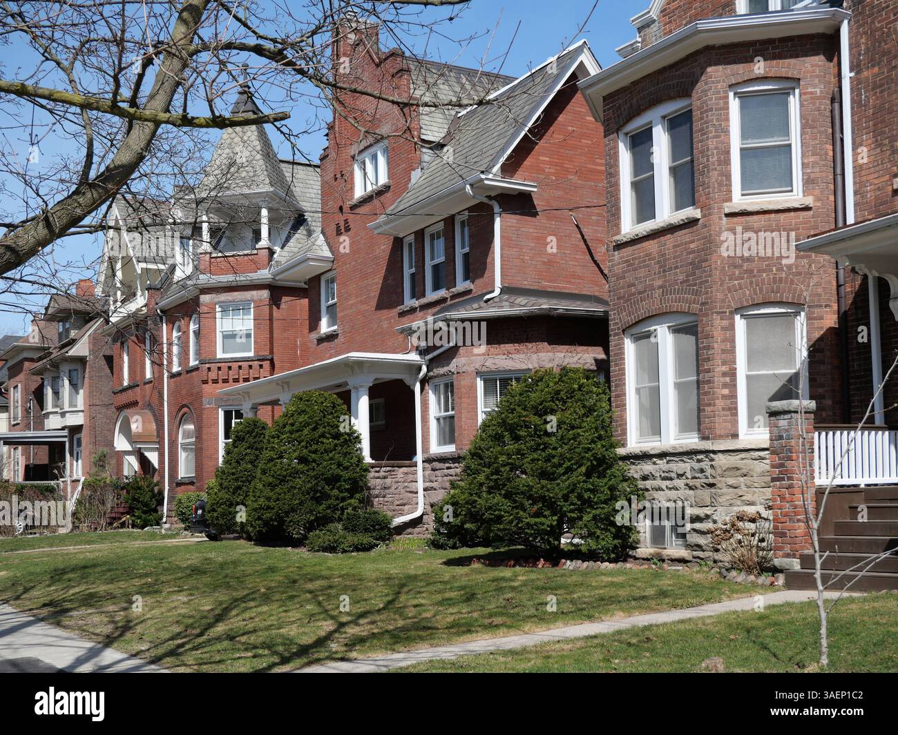 Residential neighborhood with large brick detached houses and mature ...
