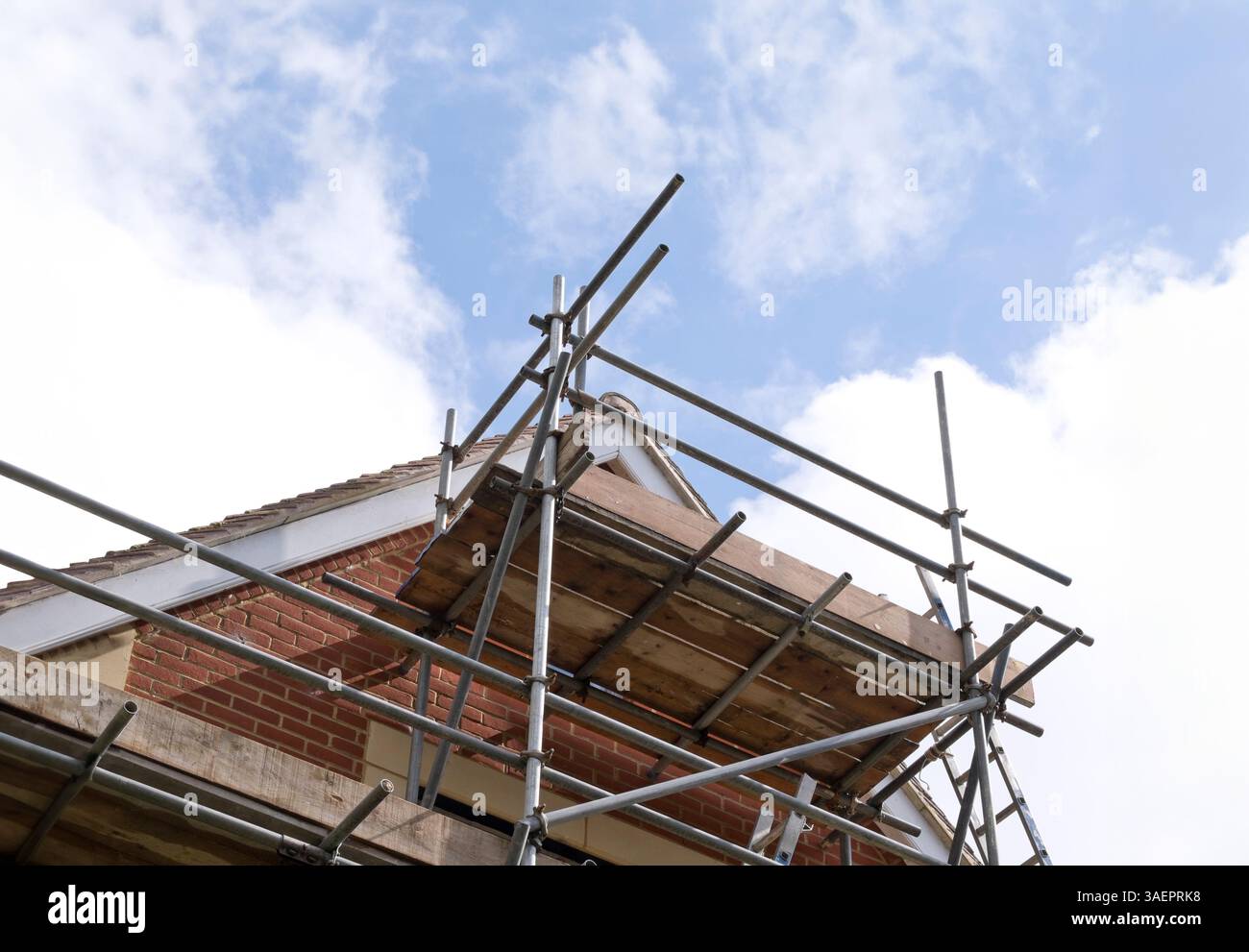 Scaffolding pile platform against a newly built domestic house on a ...