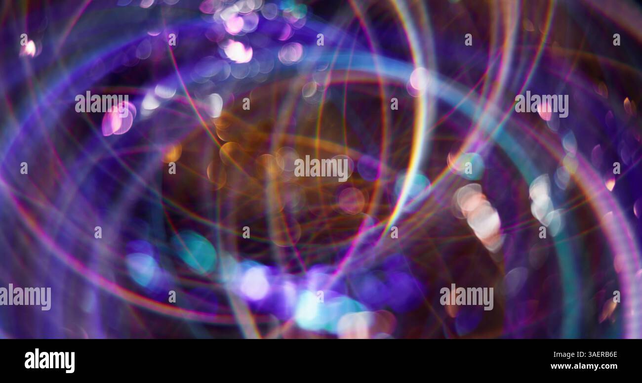 Neon circles. Defocused shiny sparkler. Purple color gleaming particles ...