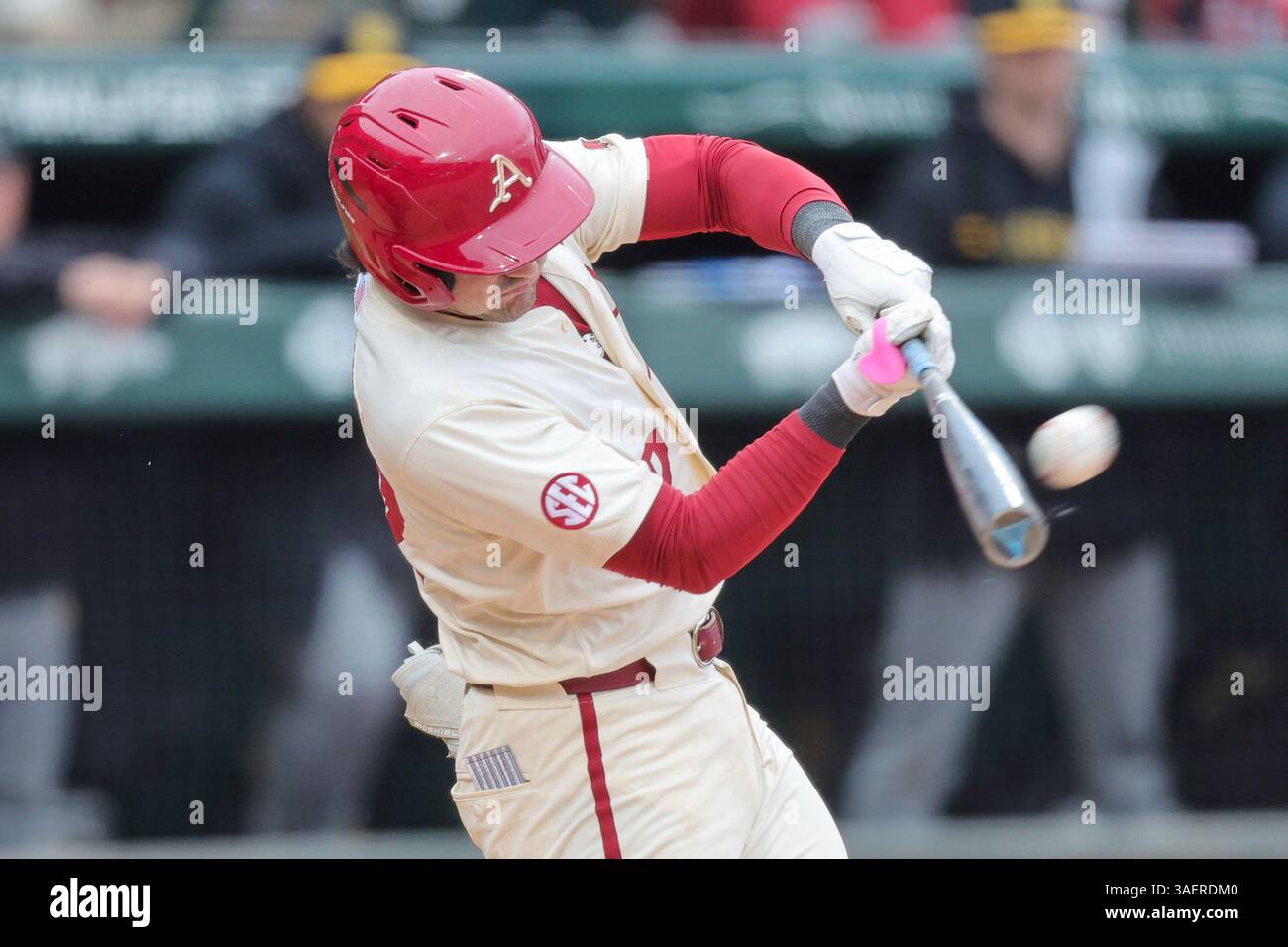 April 6, 2025: Ryder Helfrick (27) of Arkansas makes contact with the ...