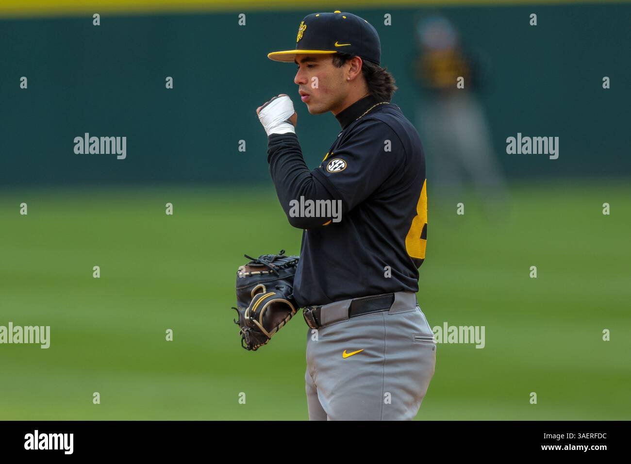 April 6, 2025: Mateo Serna (88) Missouri first baseman blows to warm up ...