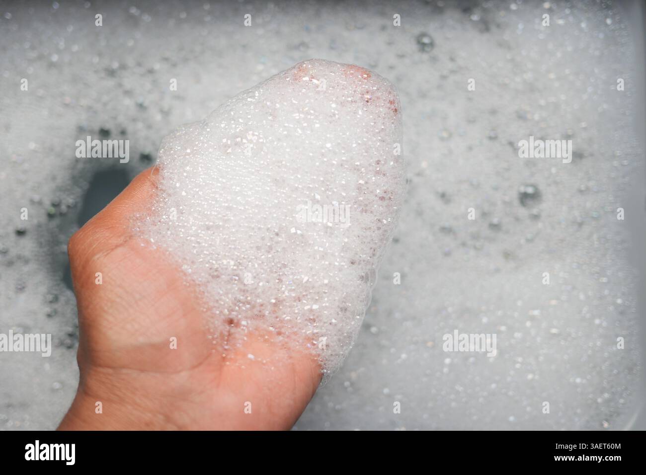 Hand covered in bubbles during a thorough hand washing process Stock ...