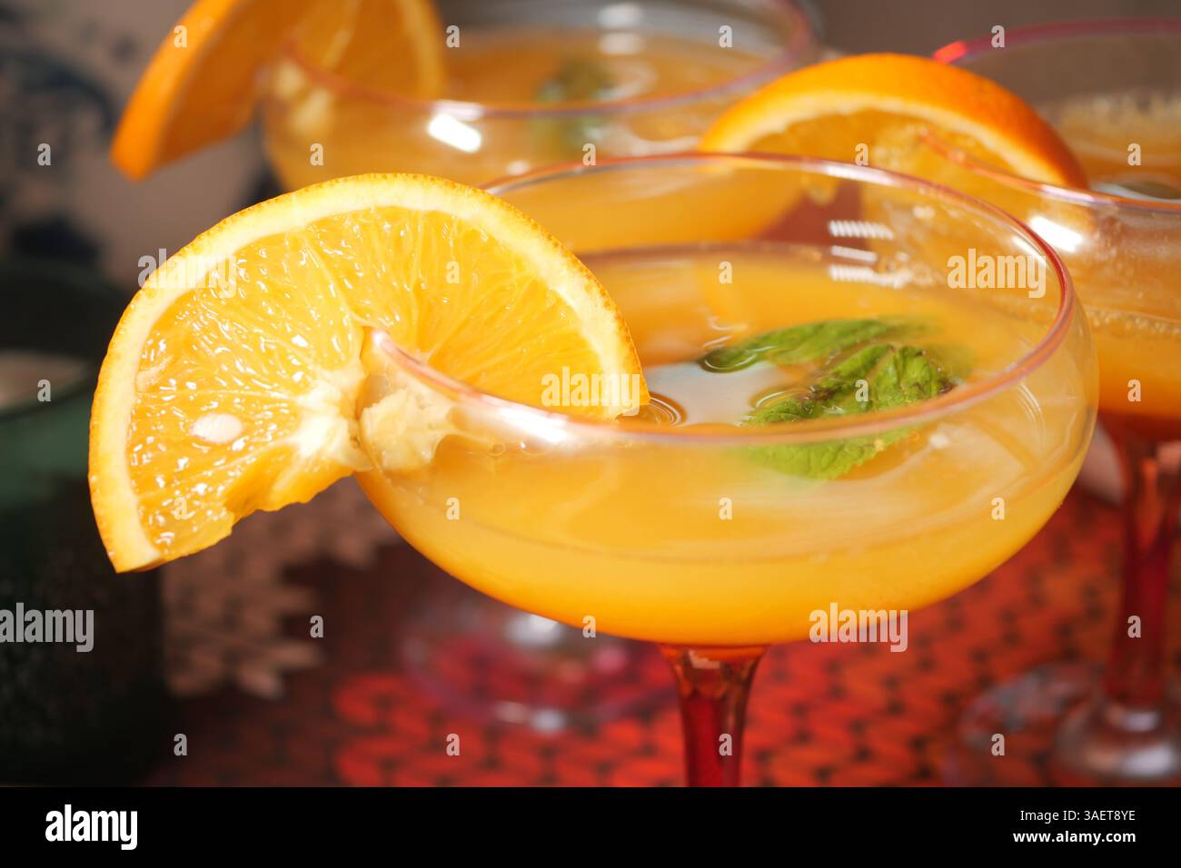 Citrus cocktails with vibrant garnishes for summer fun Stock Photo - Alamy