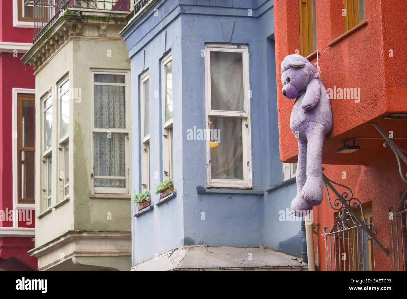 turkey istanbul 12 january 2025 Hanging teddy bear on colorful building ...