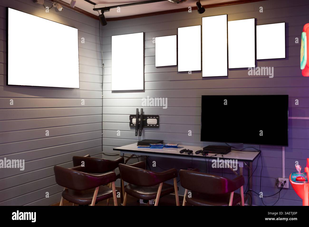 Game controller in front of TV. Simple living room interior design with ...