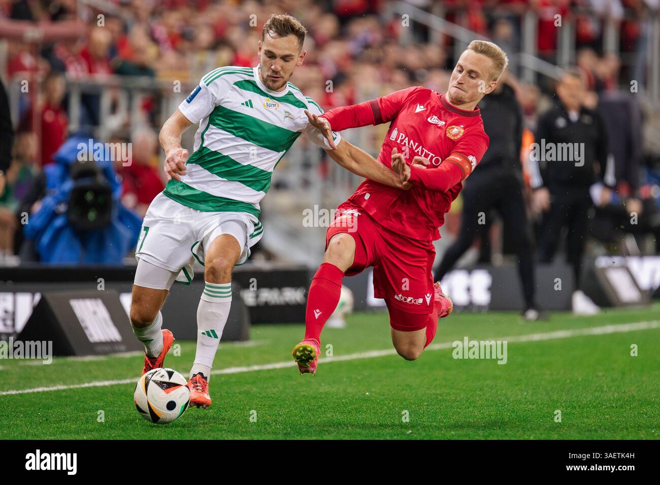 Lodz, Poland. 04th Apr, 2025. Dominik Pila (L) of Lechia and Bartlomiej ...