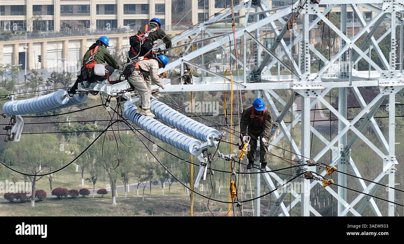 HUAI'AN, CHINA - APRIL 7, 2025 - Power workers of the State Grid ...