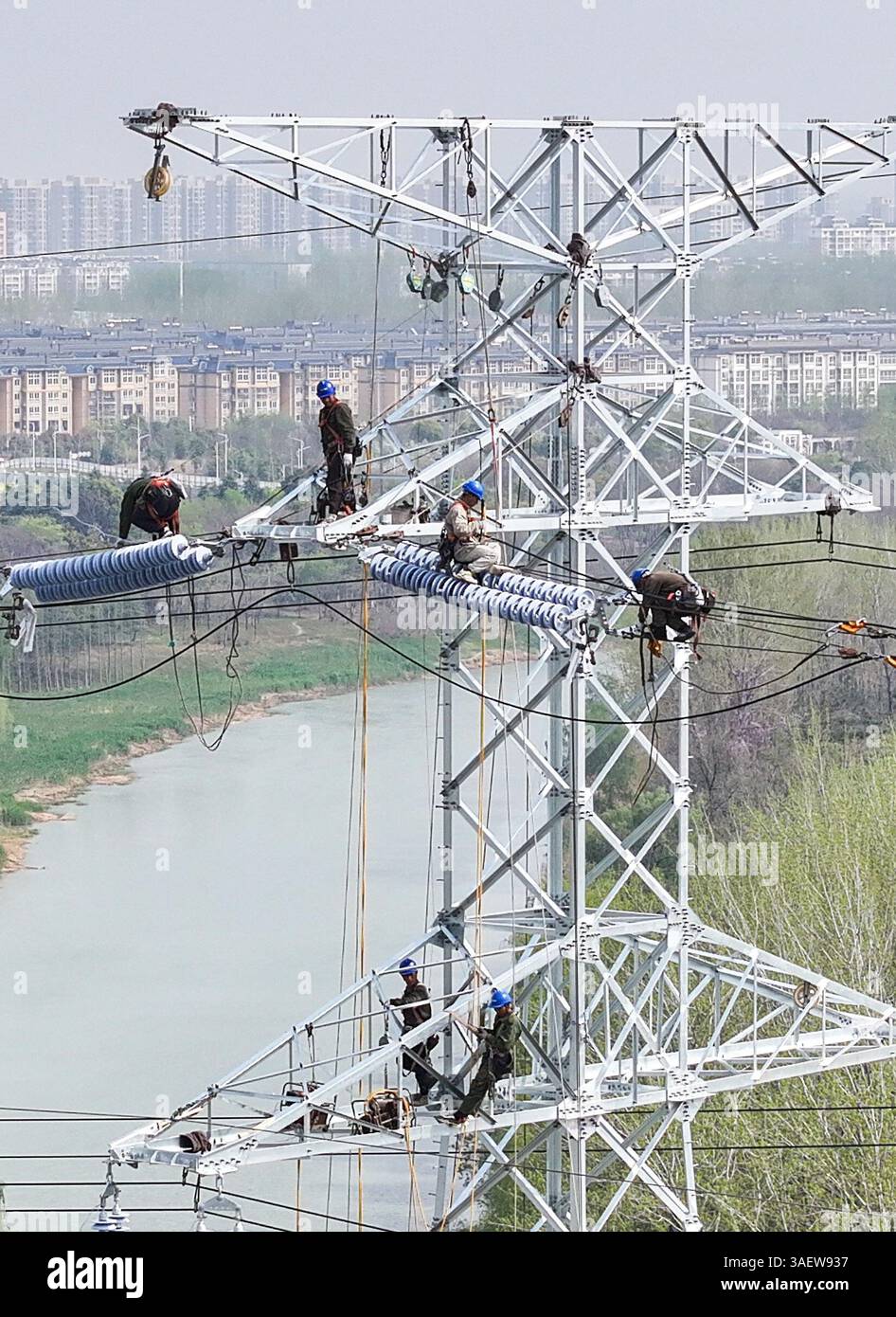 HUAI'AN, CHINA - APRIL 7, 2025 - Power workers of the State Grid ...