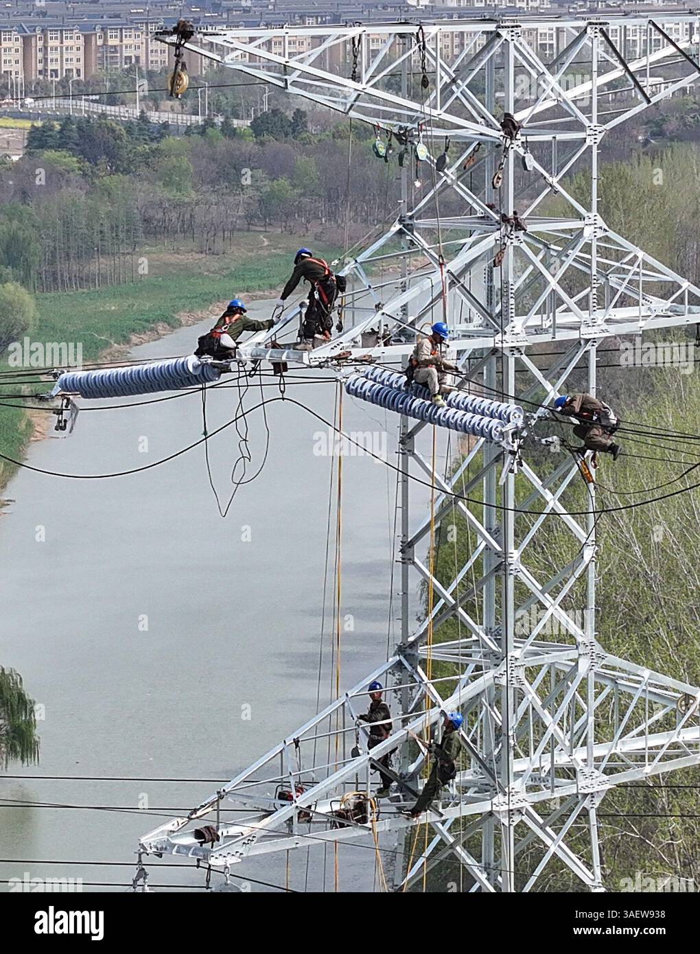 HUAI'AN, CHINA - APRIL 7, 2025 - Power workers of the State Grid ...