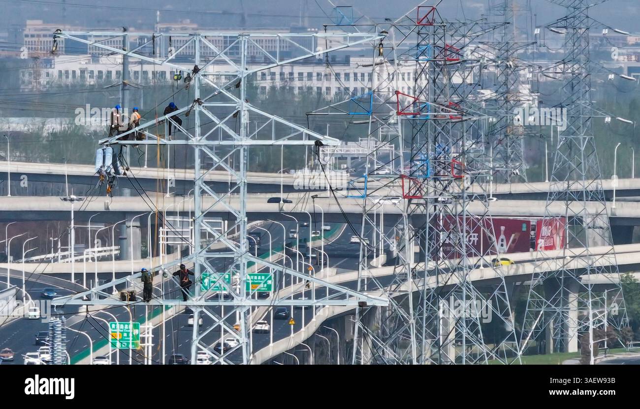 HUAI'AN, CHINA - APRIL 7, 2025 - Power workers of the State Grid ...