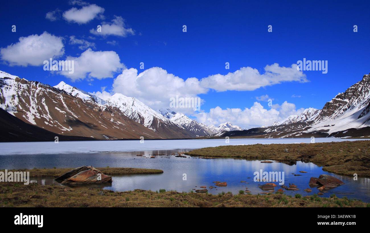 A panoramic and majestic view of half frozen Karomber Lake Stock Photo ...
