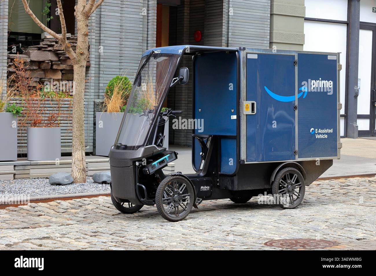 An Amazon branded Mubea U-Mobility 4 wheeled electric cargo bike on a ...