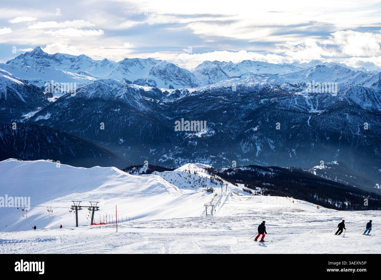 view of evening mountain peaks and ski lifts in the alps Stock Photo ...