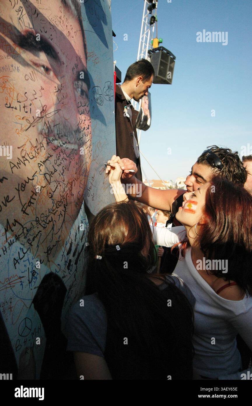 Mar 26, 2005; Beirut, LEBANON; A young Lebanese demonstrator writes a ...