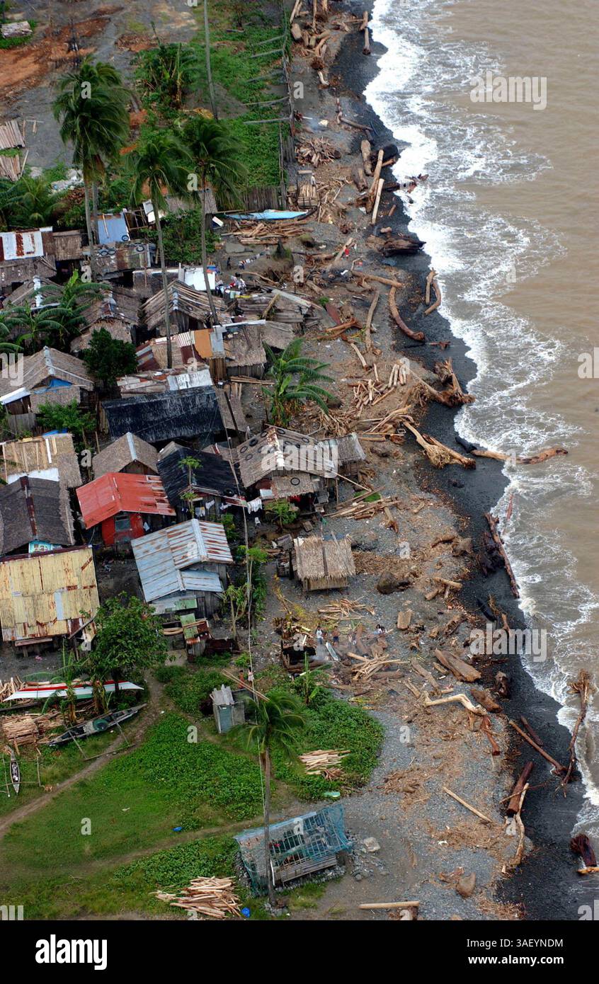 Dec 10, 2004; Real, PHILIPPINES; Logs cover the beach near destroyed ...