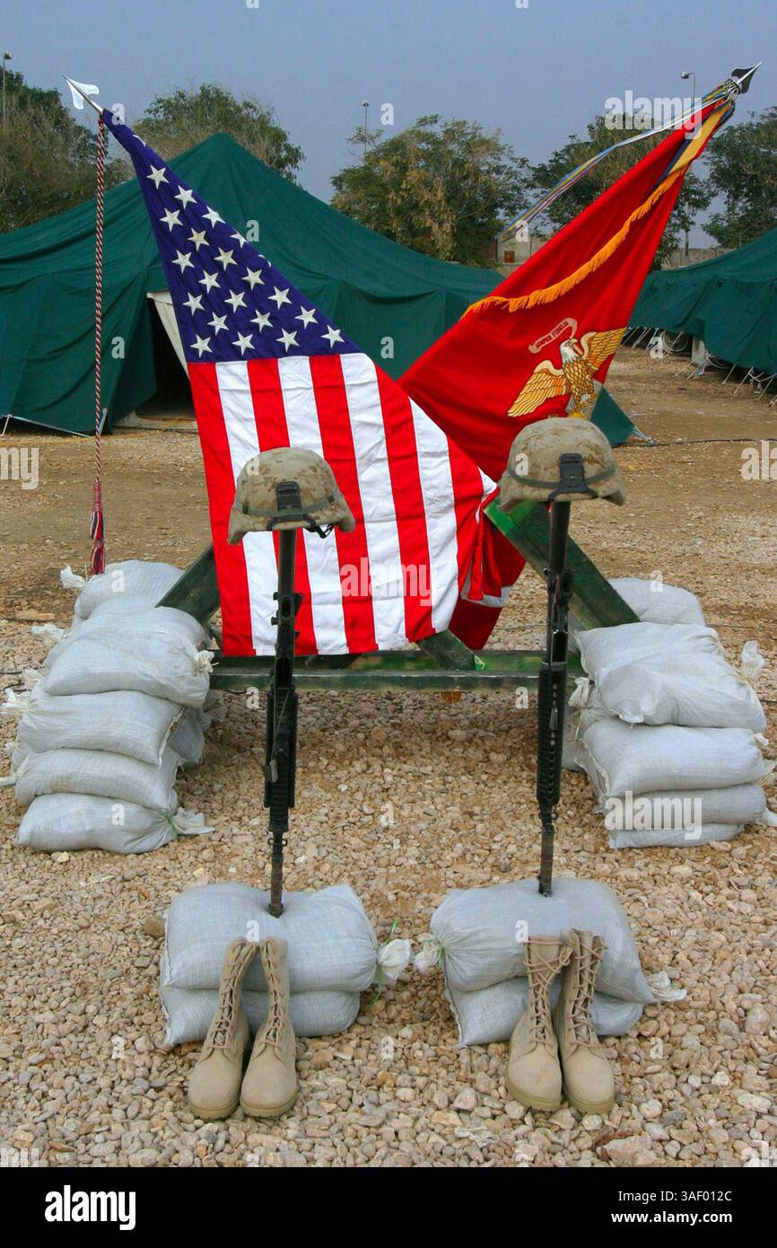 Dec 12, 2004; FOB Iskandariyah, Iraq; Two rifles, two pairs of boots ...