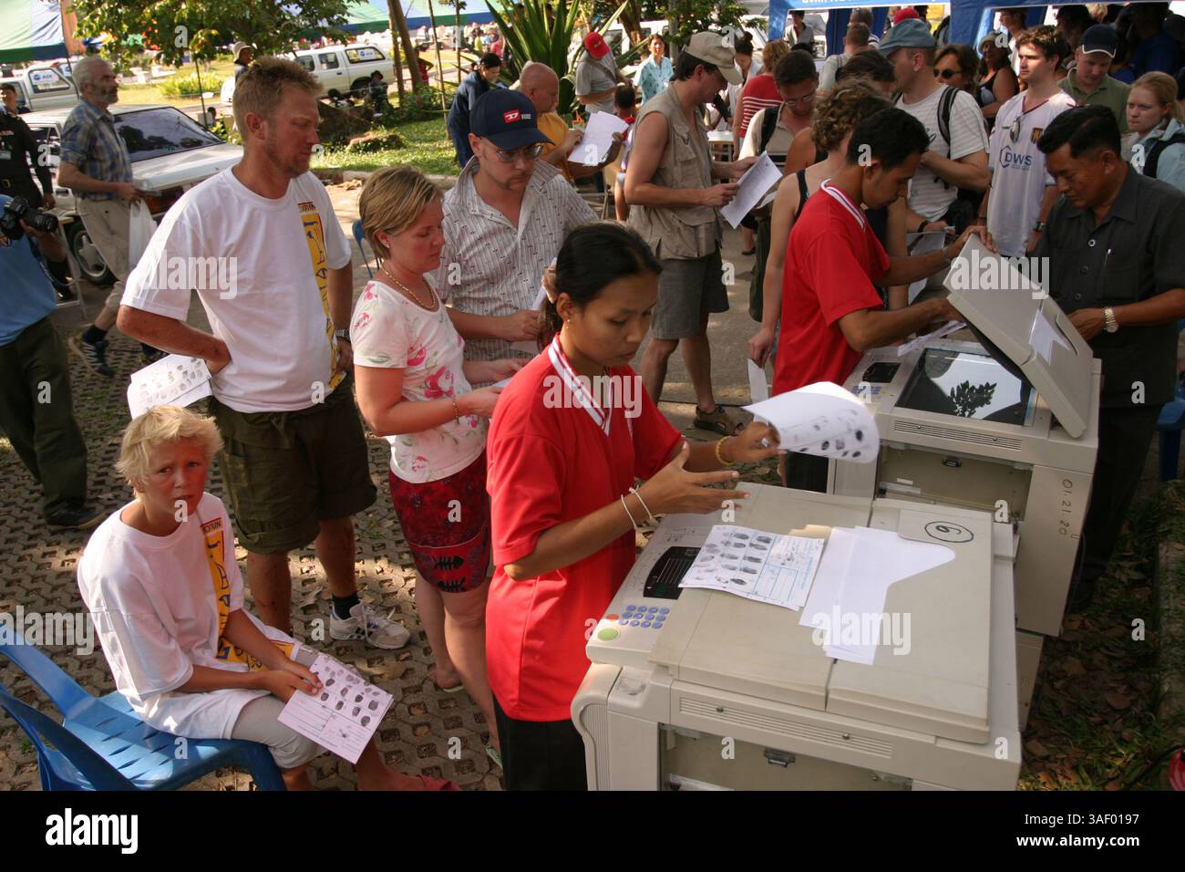 Dec 27, 2004; Phuket Island, THAILAND; Survivors and rescuers are ...