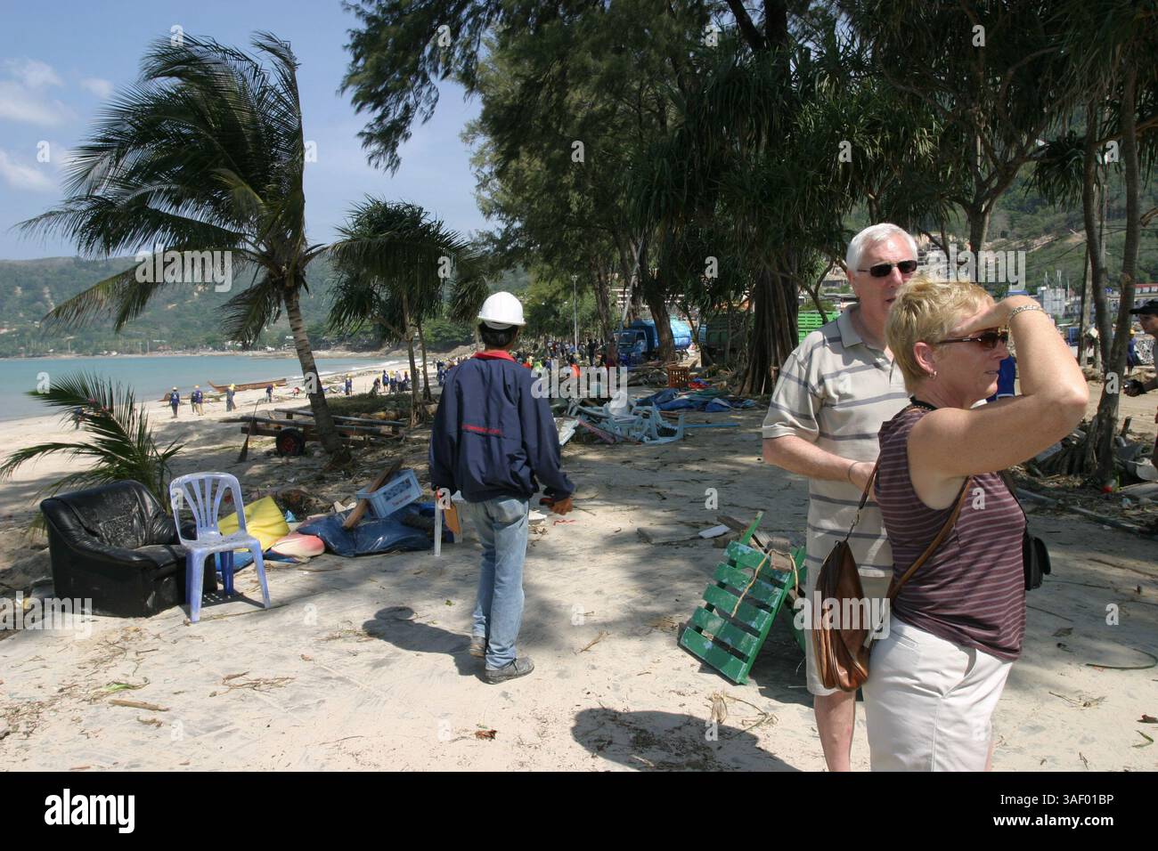 Dec 27, 2004; Phuket Island, THAILAND; Survivors and rescuers are ...