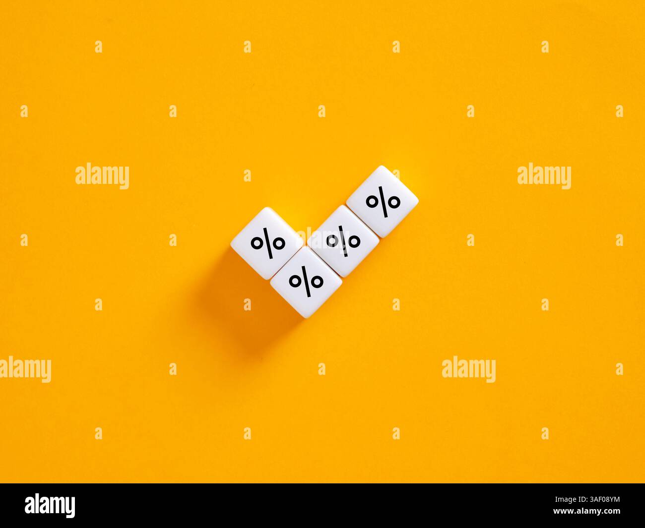 Four white dice with percentage symbols arranged on a vibrant yellow ...