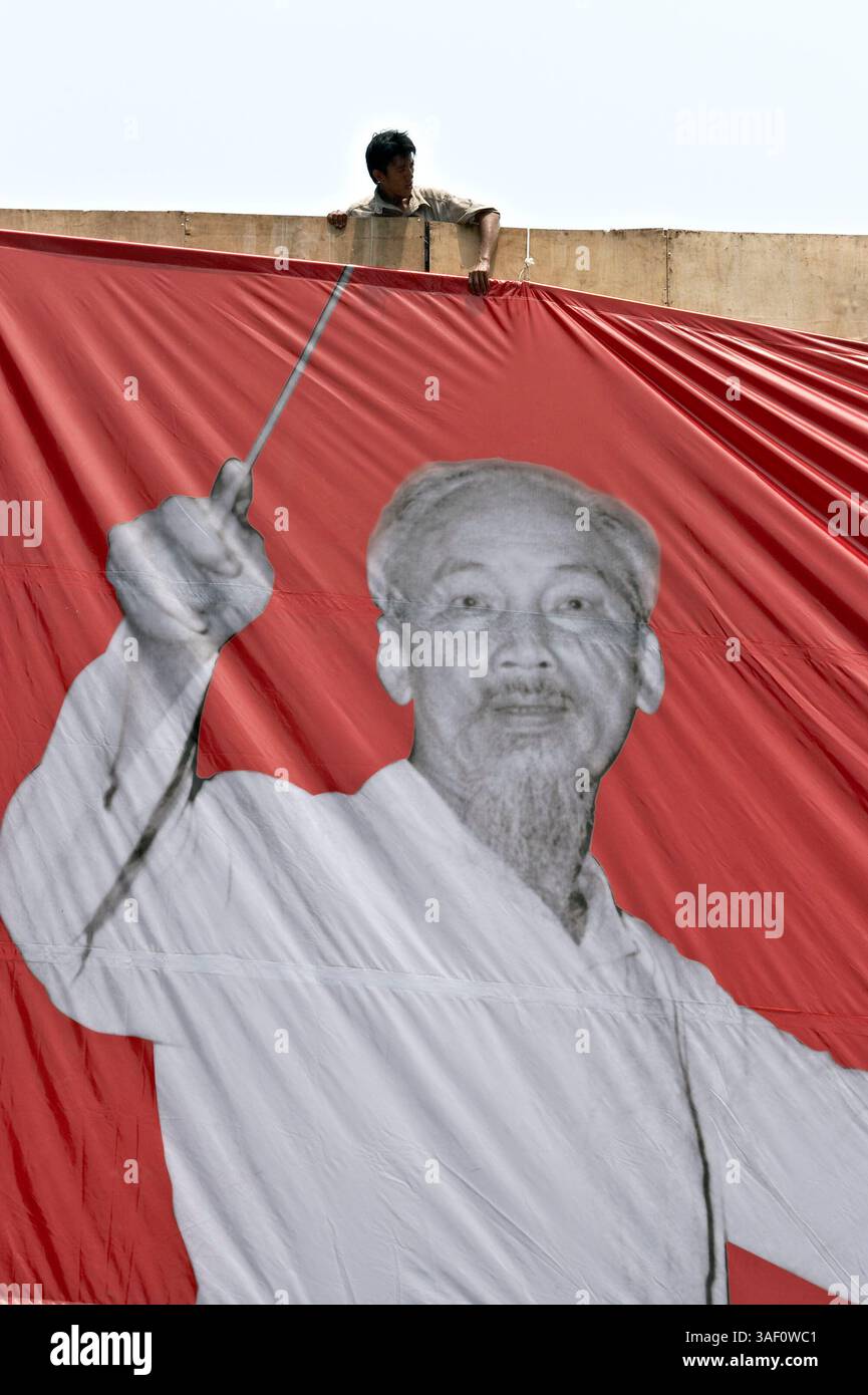 Apr 14, 2005; Ho Chi Minh, VIETNAM; A worker installs a banner of ...