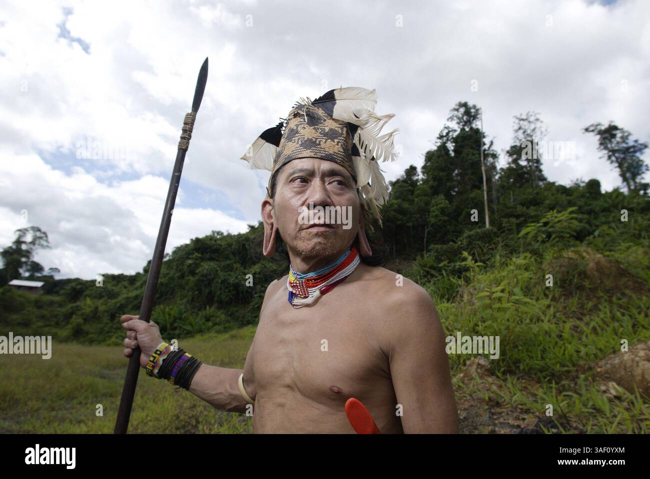 Jun 14, 2002; Sarawak, MALAYSIA; ALONG SEGA, a nomadic Penan chief ...