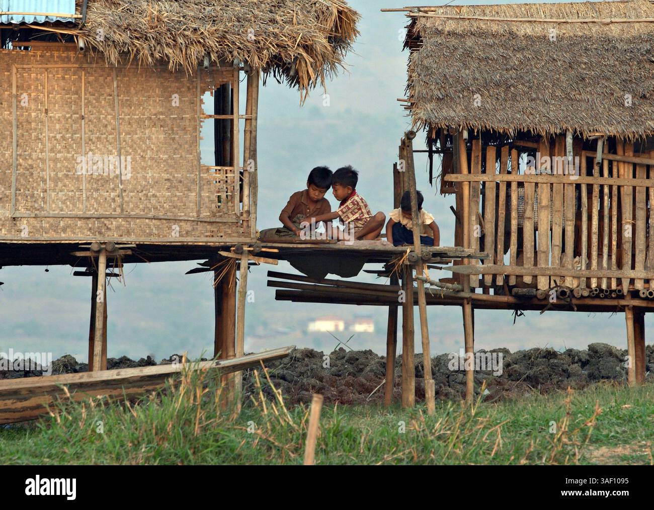 Apr 12, 2004; Nyaungshwe, BURMA (MYANMAR); Boys play on their bamboo ...