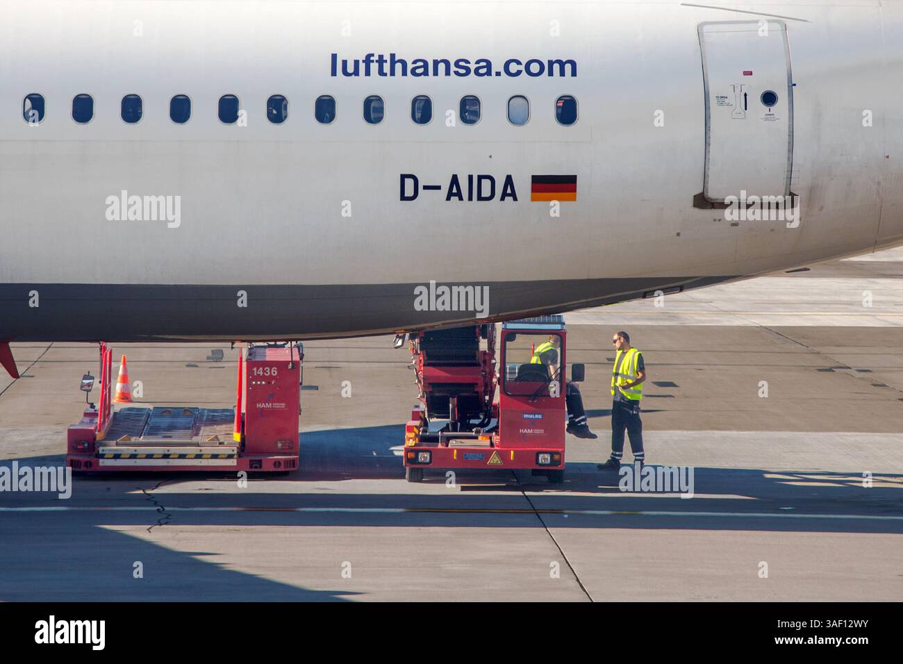 Hamburg, Germany - July 17, 2014: ground operation personal loading the ...