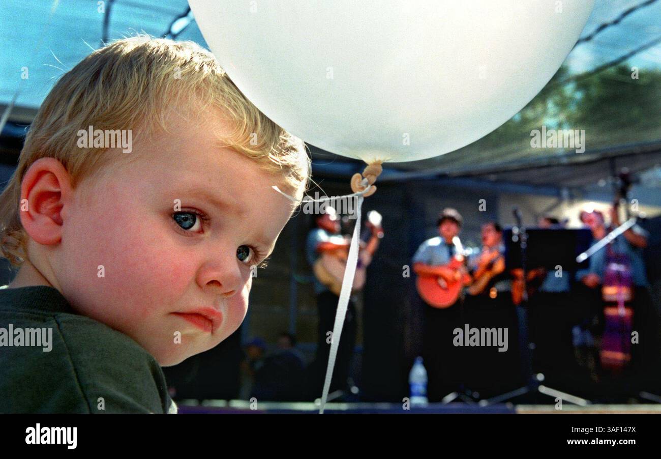 Sean Langdon, 2, is momentarily distracted by the sights while sitting ...