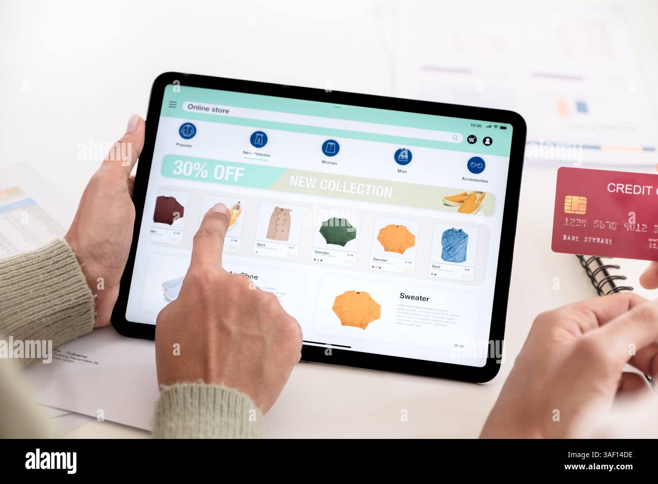 Couple using tablet and credit card to shop online through e-commerce ...